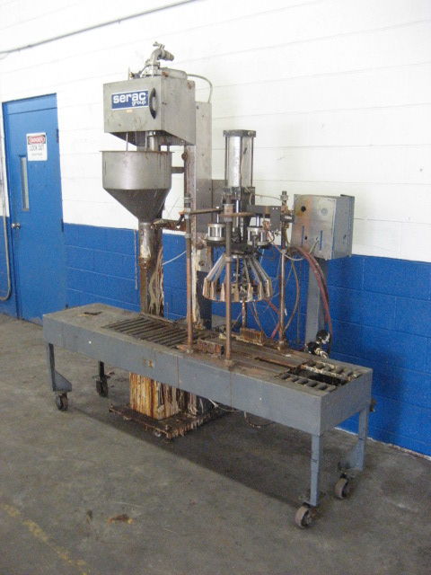 Serac Filler with Pail Lid Crimper.