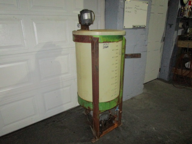 50 gallon Poly tank with agitator and pump.